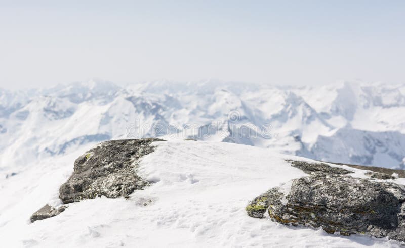 Snow Covered Rock with a Mountain View in the Back Stock Photo - Image ...