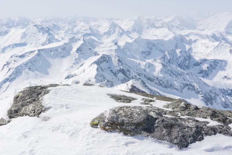 Snow Covered Rock with a Mountain View in the Back Stock Image - Image ...