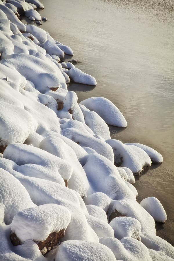 Snow Covered Rocks stock image. Image of color, stone - 26719463
