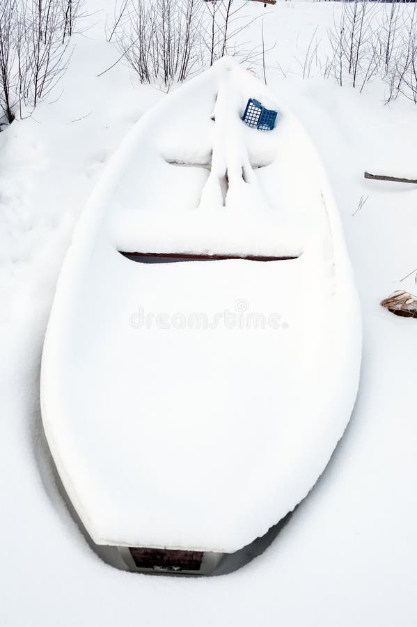 Snow covered rowboats stock photo. Image of powder, bright - 128929342