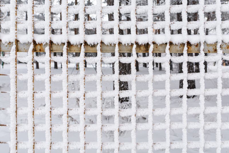 Snow Covered Rusty Metal Fence Mesh. Freezing Day Stock Image - Image ...