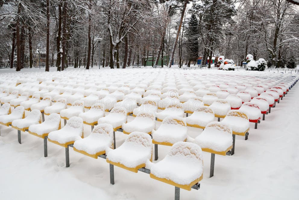 Snow-covered seats stock image. Image of scene, white - 28175621