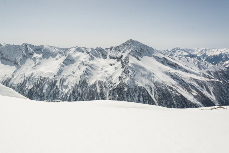 Snow Covered Slope with Mountain Ridge in the Back Stock Photo - Image ...