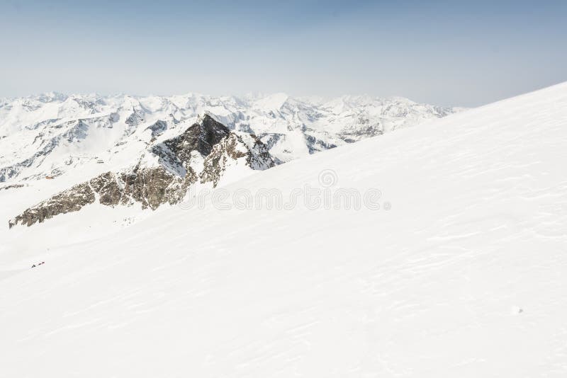 Snow Covered Slope with Mountain Ridge in the Back Stock Image - Image ...