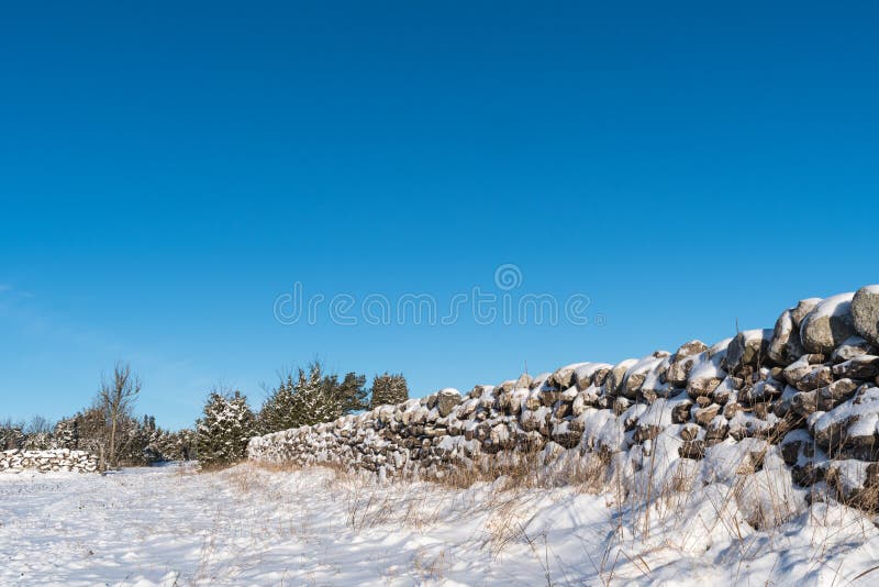 Snow Covered Stone Wall from a Low Perspective Stock Image - Image of ...
