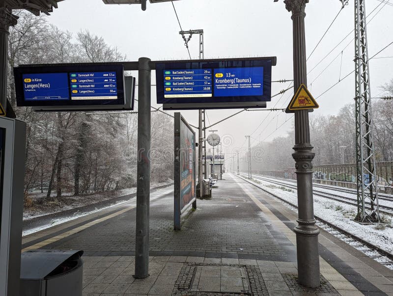 Snow-covered Train Station Platform with Digital Signs Editorial Stock ...