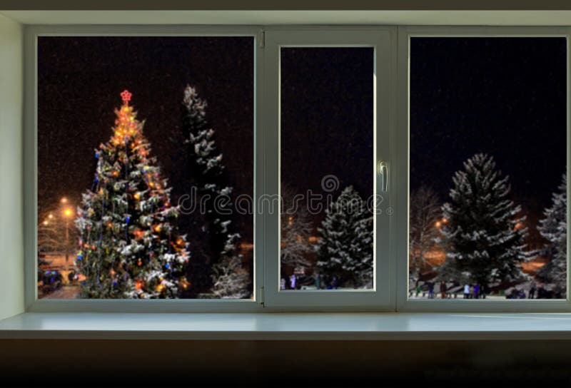Snow-covered Trees Near the Christmas Tree Outside the Window Stock ...