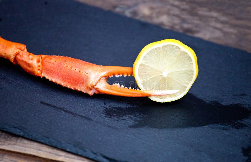 Snow Crab Claw with Lemon on a Table. Selective Focus Stock Image ...