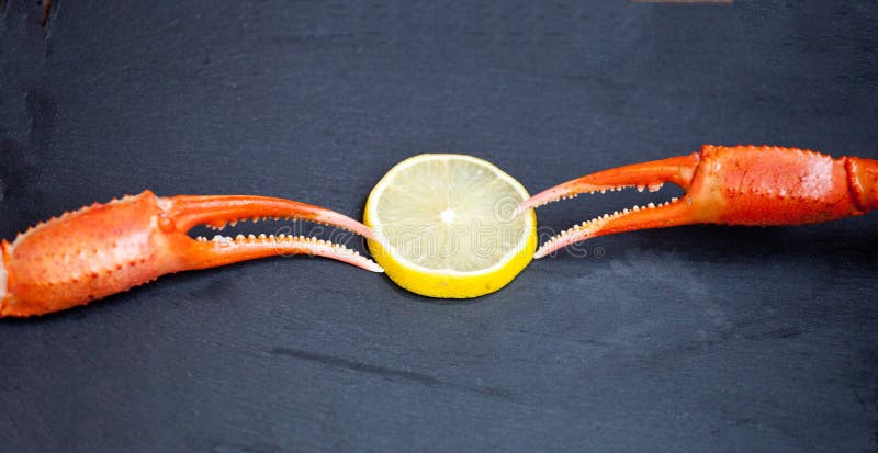Snow Crab Claw with Lemon on a Table. Selective Focus Stock Image ...