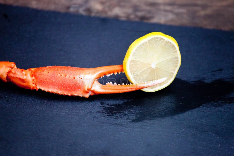Snow Crab Claw with Lemon on a Table. Selective Focus Stock Image ...