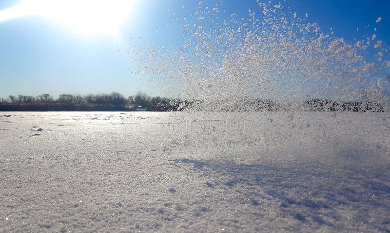 Snow Explosion on the Background of the Bright Sun Stock Photo - Image ...