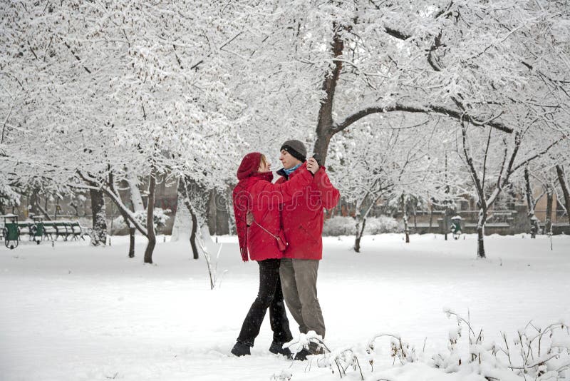 Young Couple Dancing in Snow Stock Photo - Image of adult, nature: 35141676