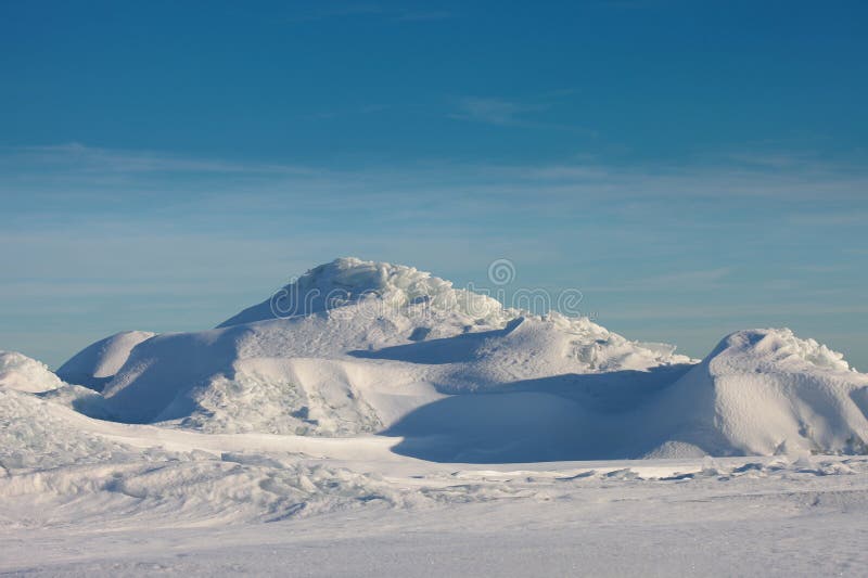 Snow Desert and Blue Winter Sky. Mountains on the Horizon Stock Photo ...