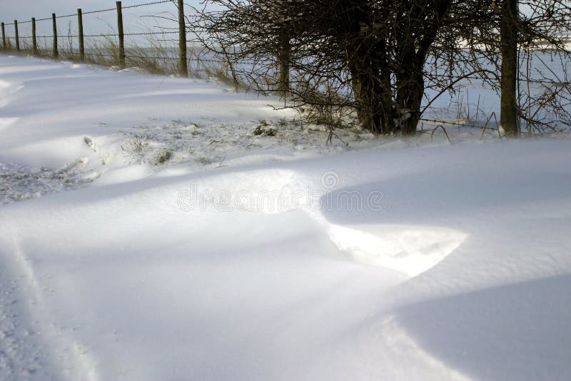 A Snow Drift at the Side of the Road. Stock Image - Image of drifts ...