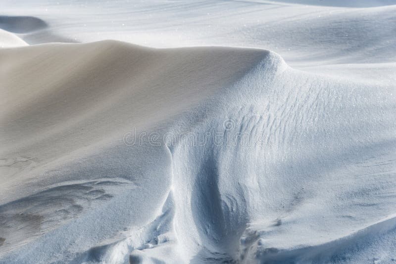 Snow drift on sunny day stock photo. Image of crystal - 131693236