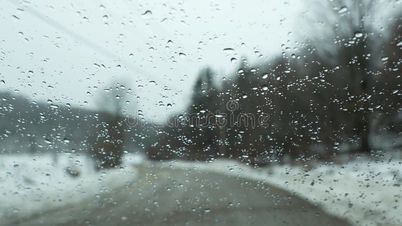 Snow Fall on Window and Melting into Water Drops on Glass in the Forest ...