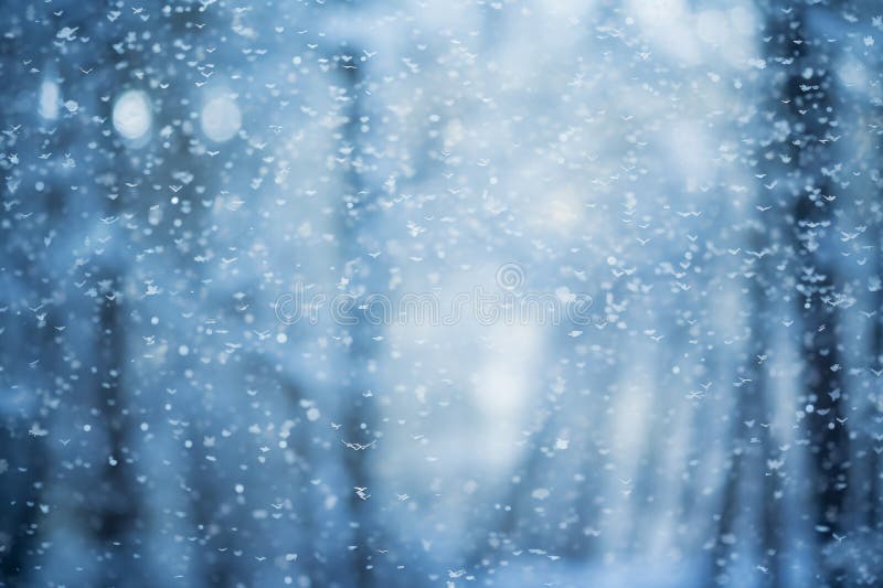 Snow Falling on a Blue Background with Trees in the Background Stock ...