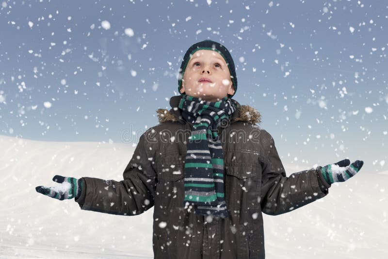 Snow Falling Down on Boy Looking Up Stock Photo - Image of coat, winter ...