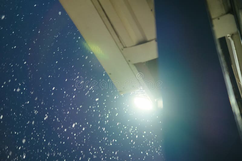 Snow Falling at Night Under a Lamp Post Stock Photo - Image of ...