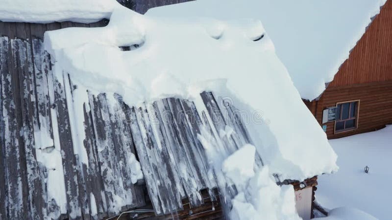 Snow falling from the roof stock footage. Video of falling - 273413548
