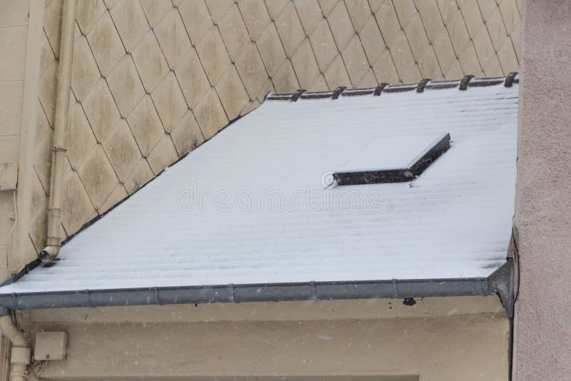 Snow falling on a roof stock image. Image of roof, white - 200262389