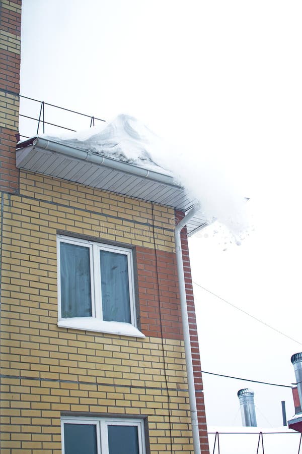 Snow is Falling from the Roof of a Multi-storey Building Stock Image ...