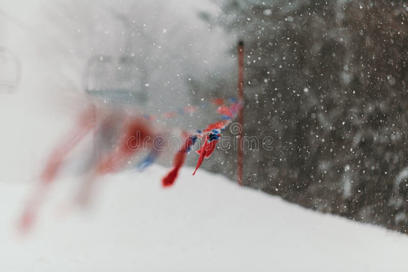 Snow Falling in Winter at Ski Slope Stock Image - Image of flag ...