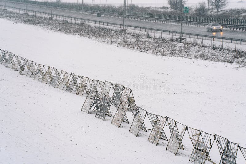 Snow fence by highway stock photo. Image of cold, highway - 267888888