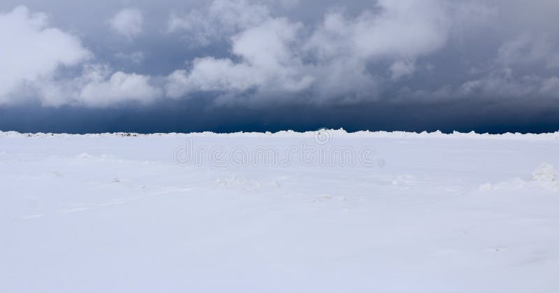 Snow Field. the Plain is Covered with White Snow Under a Blue Sky with ...