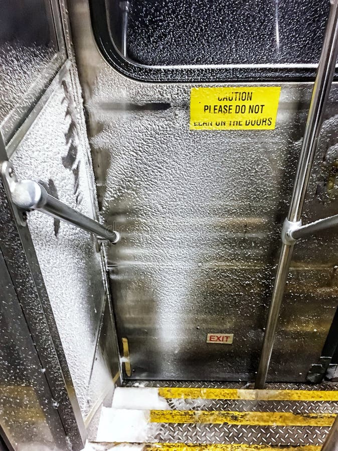 Snow Filled Interior of Train Car with Caution Sign. Stock Photo ...