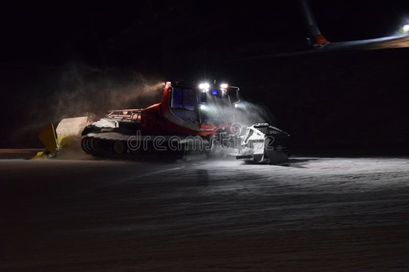 A Snow Groomer Compacting Ski Runs at Night Editorial Stock Image ...