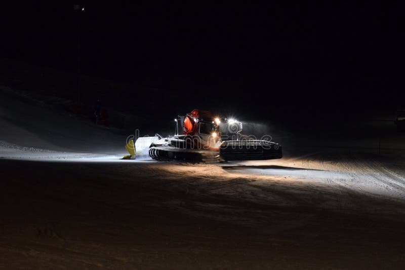 A Snow Groomer Compacting Ski Runs at Night Editorial Stock Image ...