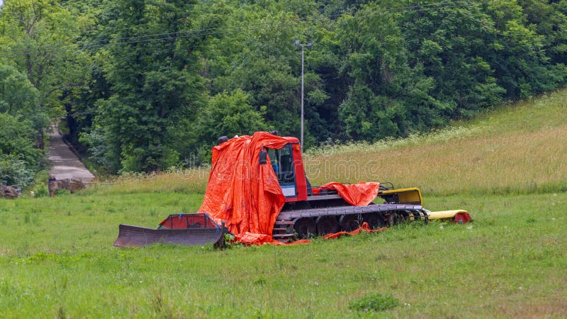 Snow Groomer Under Tarp stock photo. Image of tracked - 266340318