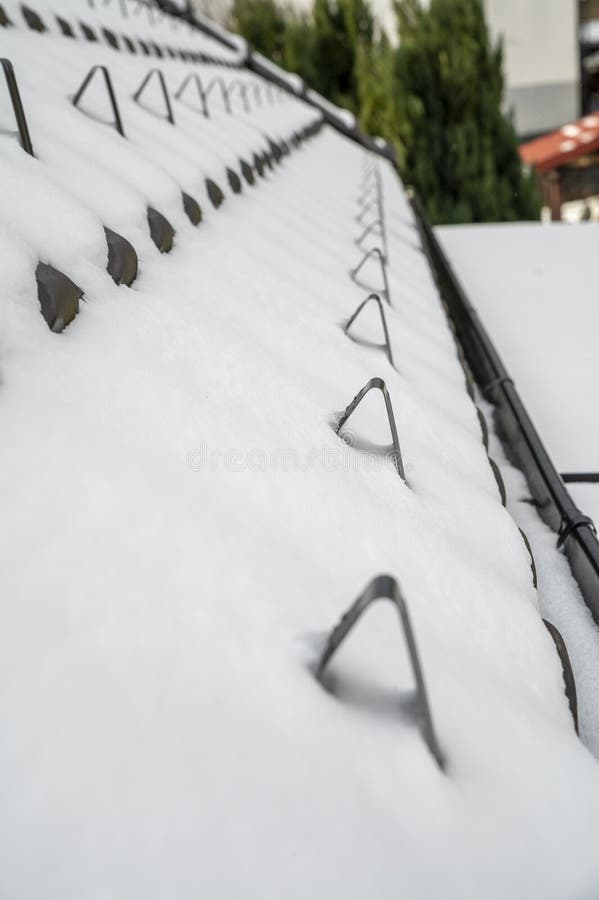 Snow Guards, Retainers or Snow Hooks on the Tile Roof Covered by Snow ...