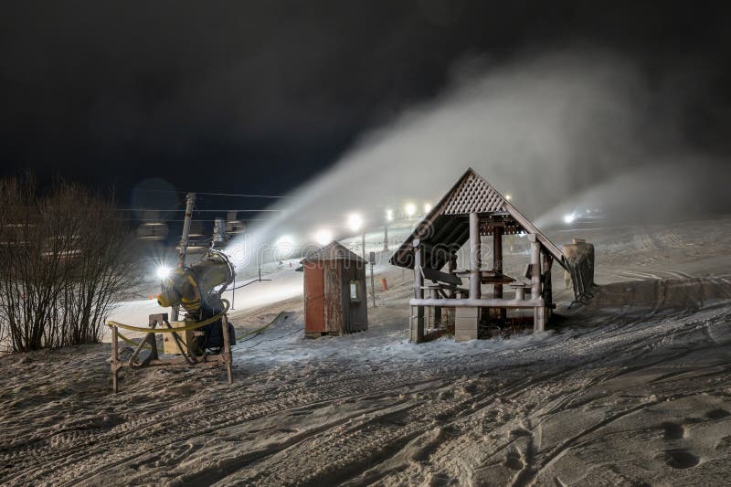 Snow Gun Making Snow at Night on the Ski Slope. Snow Making System at ...