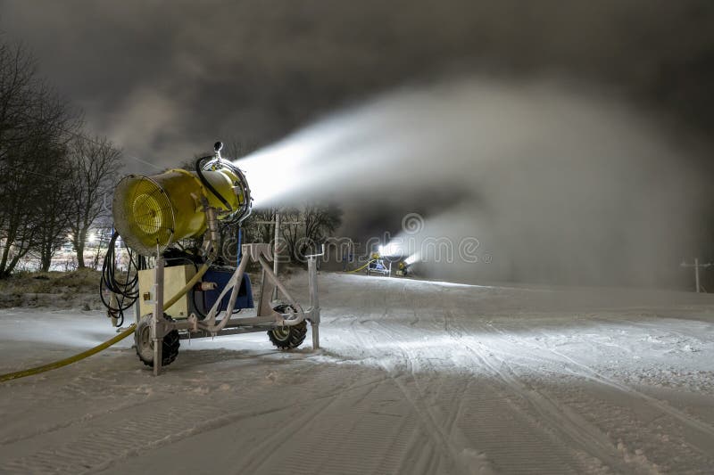 Snow Gun Making Snow at Night on the Ski Slope. Snow Making System at ...