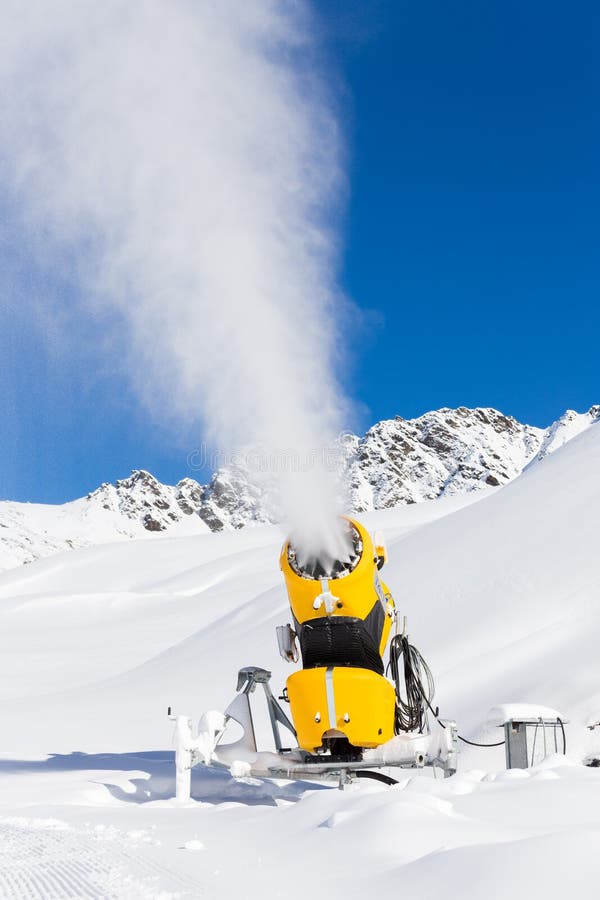 Snow gun in the mountains stock photo. Image of mast - 65031772