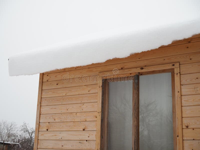 Snow is Hanging from the Roof of the House Stock Photo - Image of ...