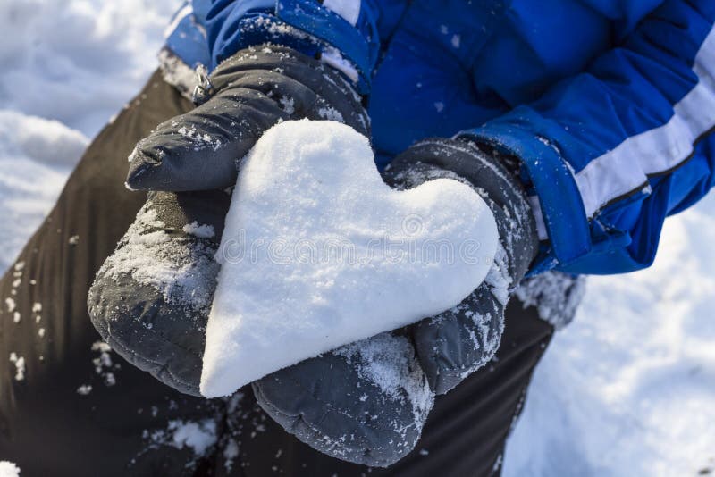 Snow heart stock photo. Image of valentine, gloves, holding - 51280226