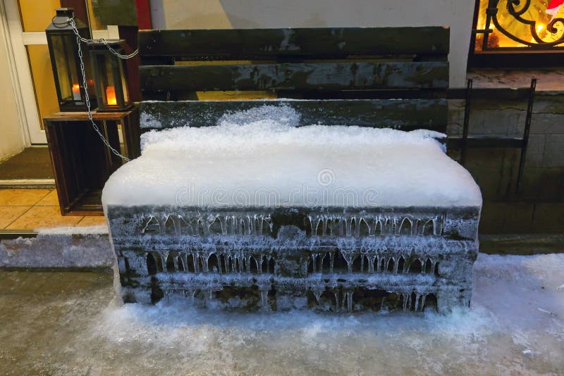 Snow and ice covered bench stock photo. Image of icicle - 139682044