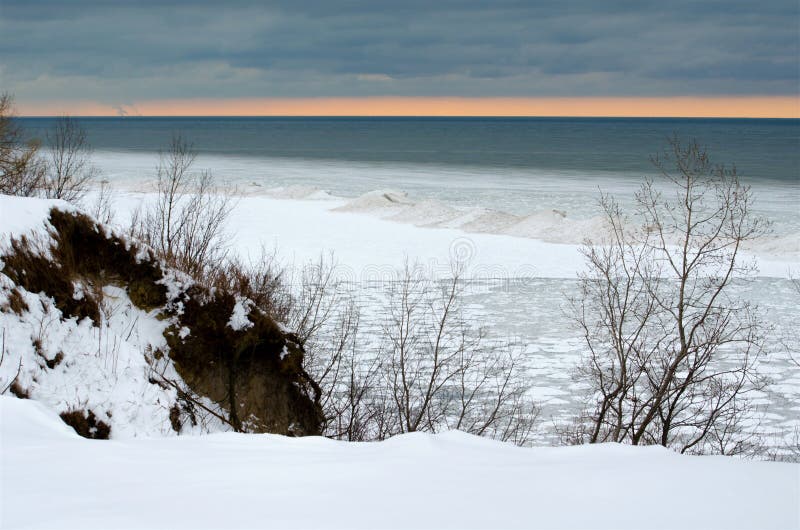 Snow and Ice at Sun Set on the Great Lakes Stock Photo - Image of water ...