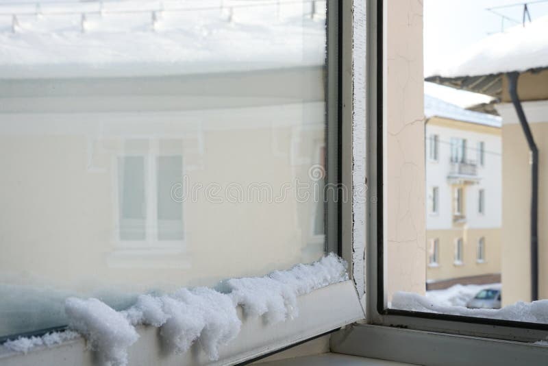 Snow and Ice on the Windows and Roofs of Buildings. Heavy Snowfall in ...