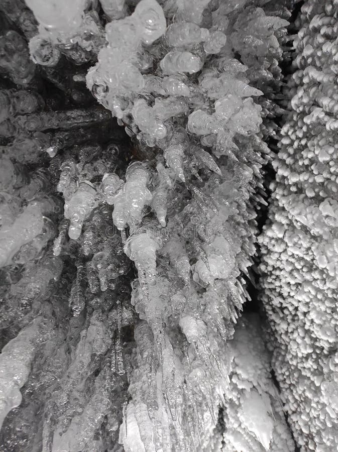 Snow Icicles and Winter Patterns on the Rocks in the Cave Stock Image ...