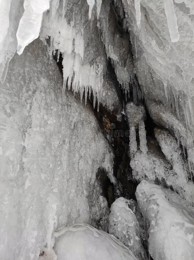 Snow Icicles and Winter Patterns on the Rocks in the Cave Stock Photo ...