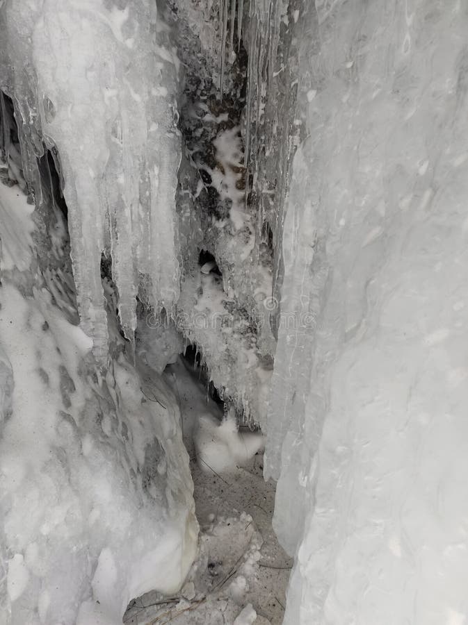 Snow Icicles and Winter Patterns on the Rocks in the Cave Stock Photo ...