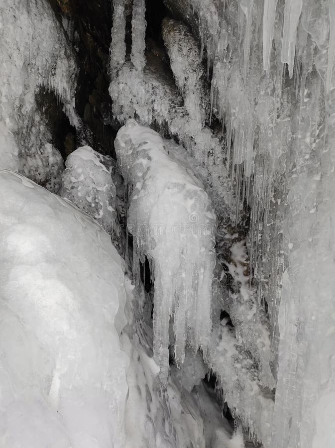 Snow Icicles and Winter Patterns on the Rocks in the Cave Stock Photo ...