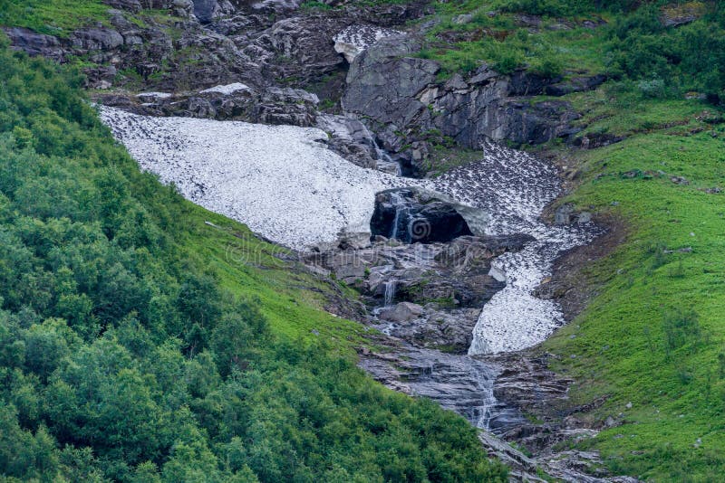 Snow Melting in the Mountain in the Summer Stock Photo - Image of grass ...