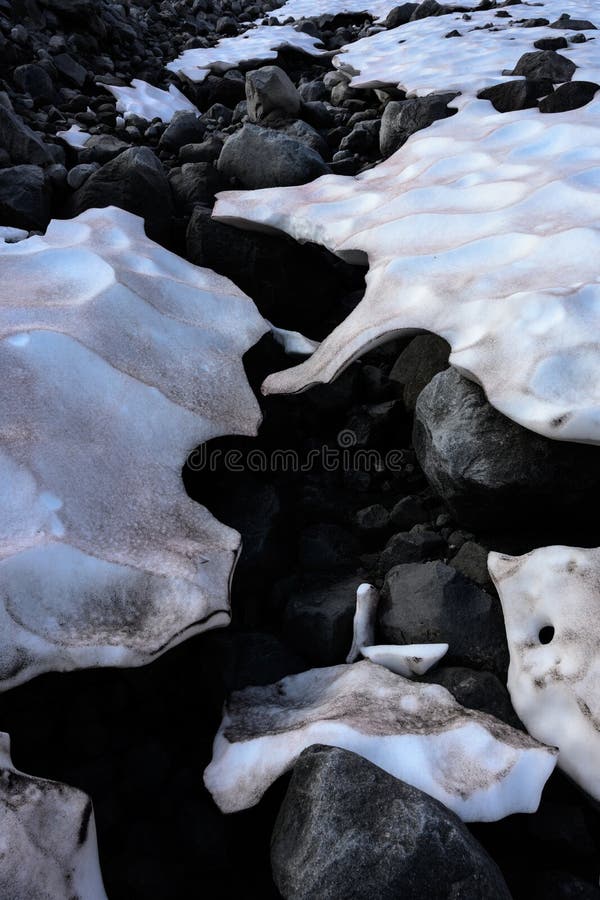 Snow Melts through To Rocks in Summer Stock Image - Image of dramatic ...