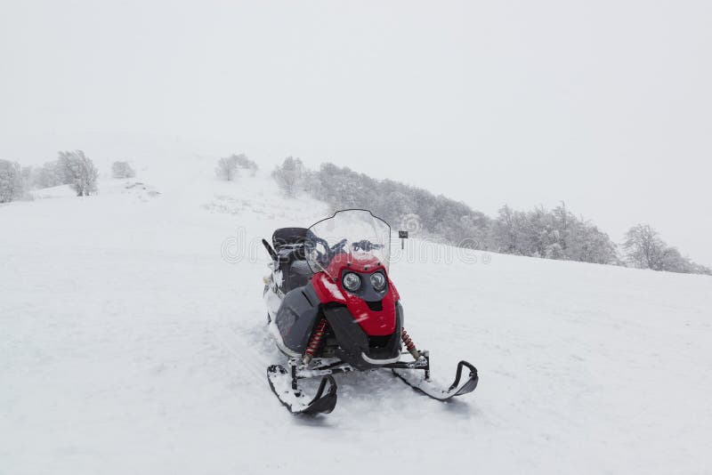 Snow mobile on the slope stock photo. Image of leisure - 236303010