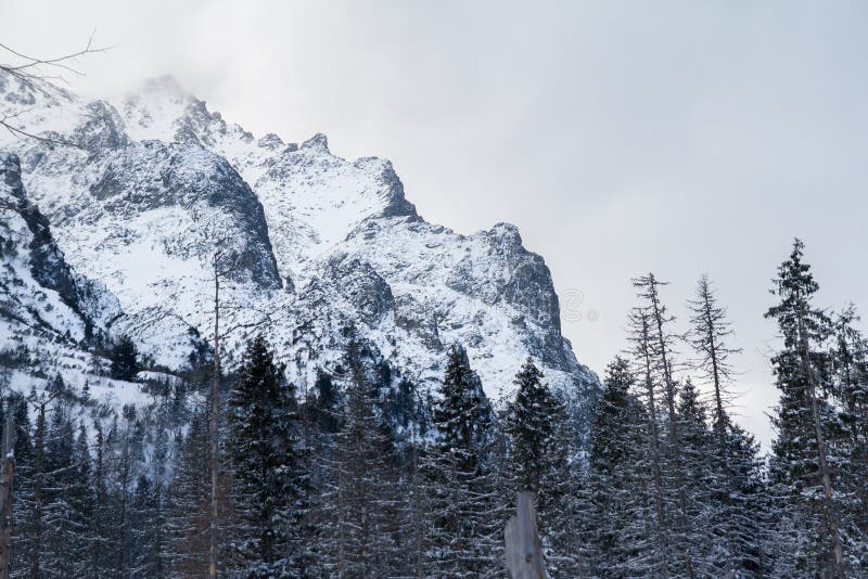 Snow mountain overcast sky stock image. Image of cold - 84304401